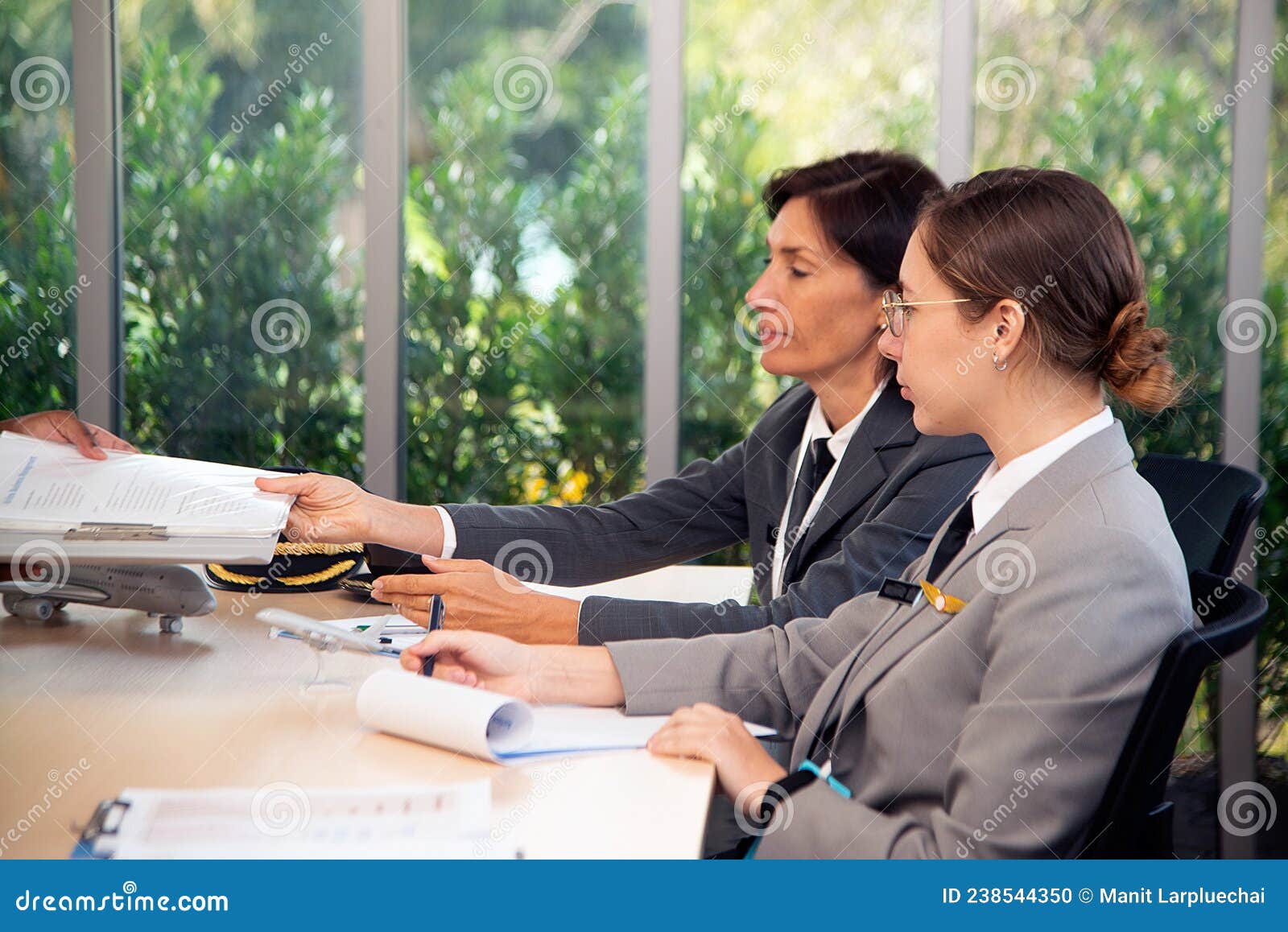 Aviation Workers are Discussing How To Work at Ground Work. Stock Photo ...