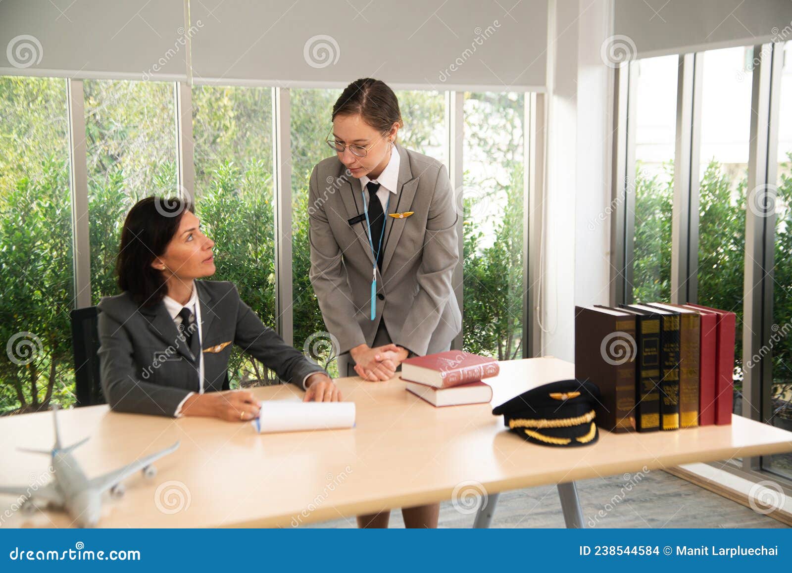Aviation Workers are Discussing How To Work at Ground Work. Stock Photo ...