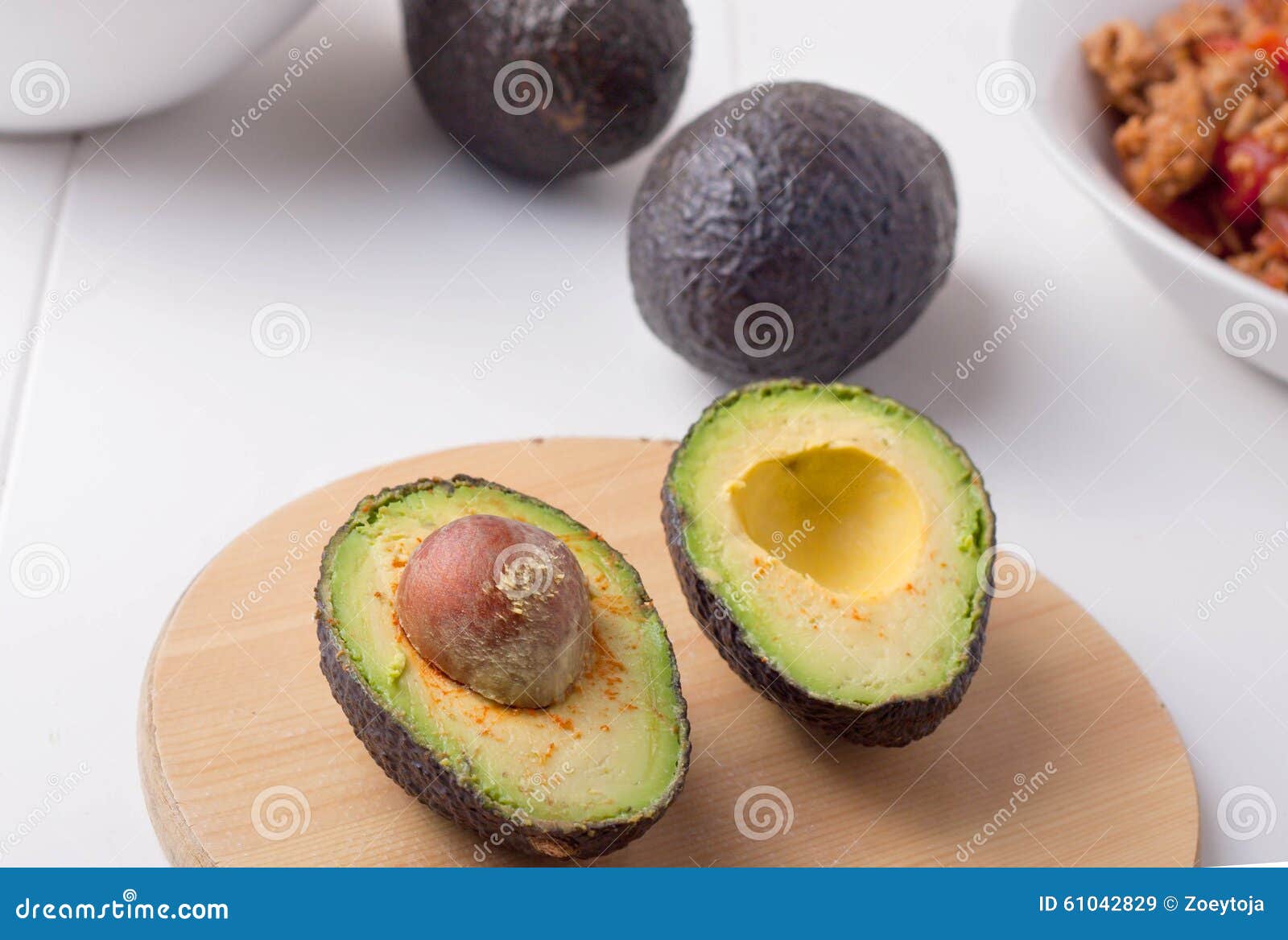 Avocado Cut in Half with a Pit Still Inside on Stock Image - Image of ...