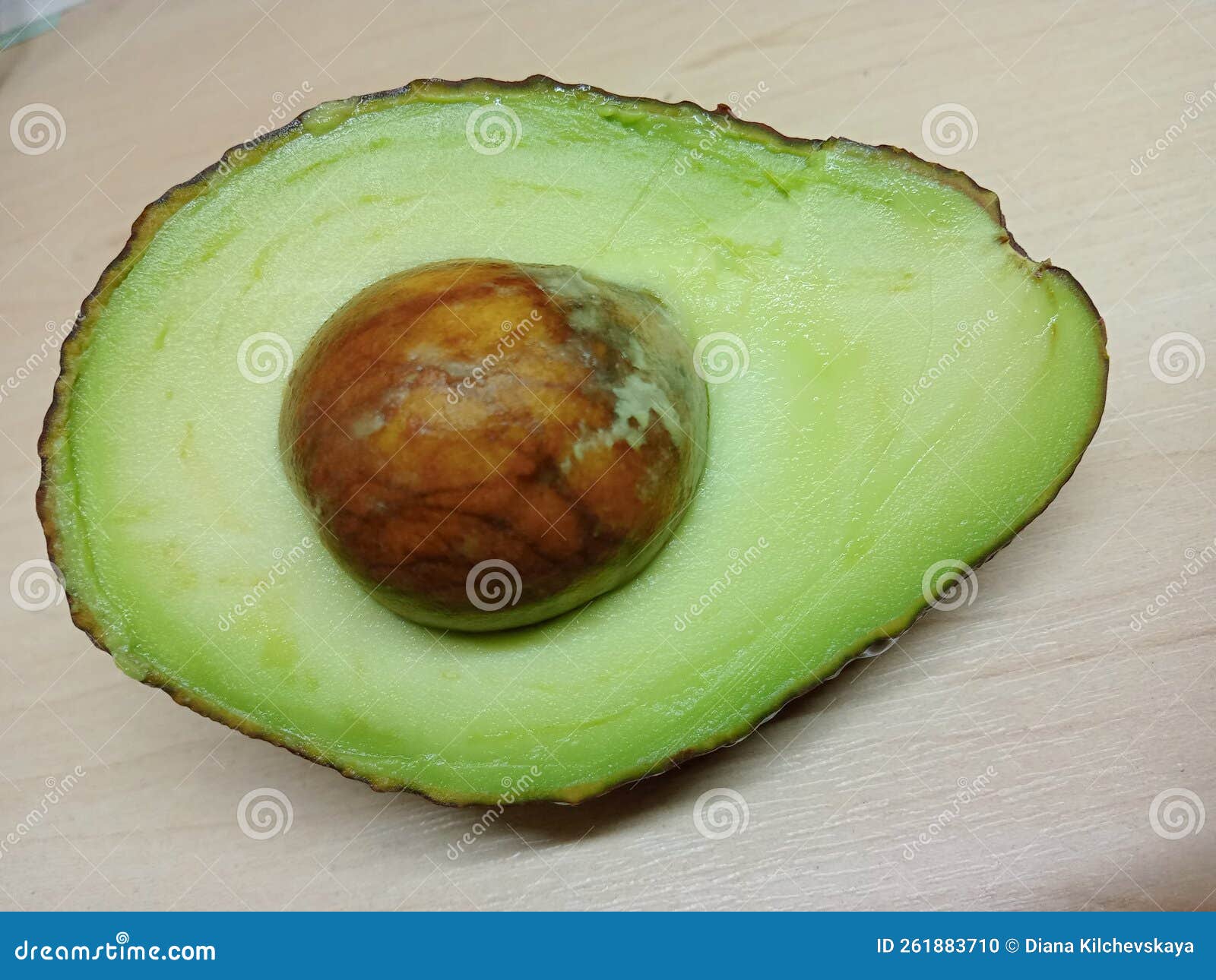 Avocado cut with pit stock photo. Image of green, brown - 261883710