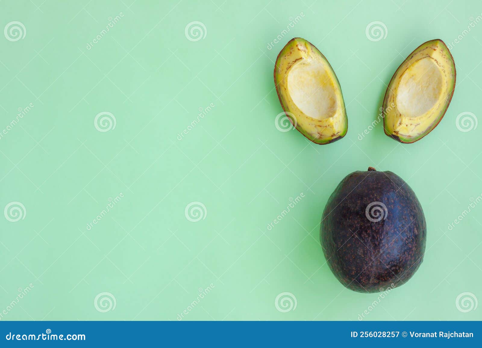 Avocado Fruit and Slice on Green Background, Rabbit Shaped of Avocado ...