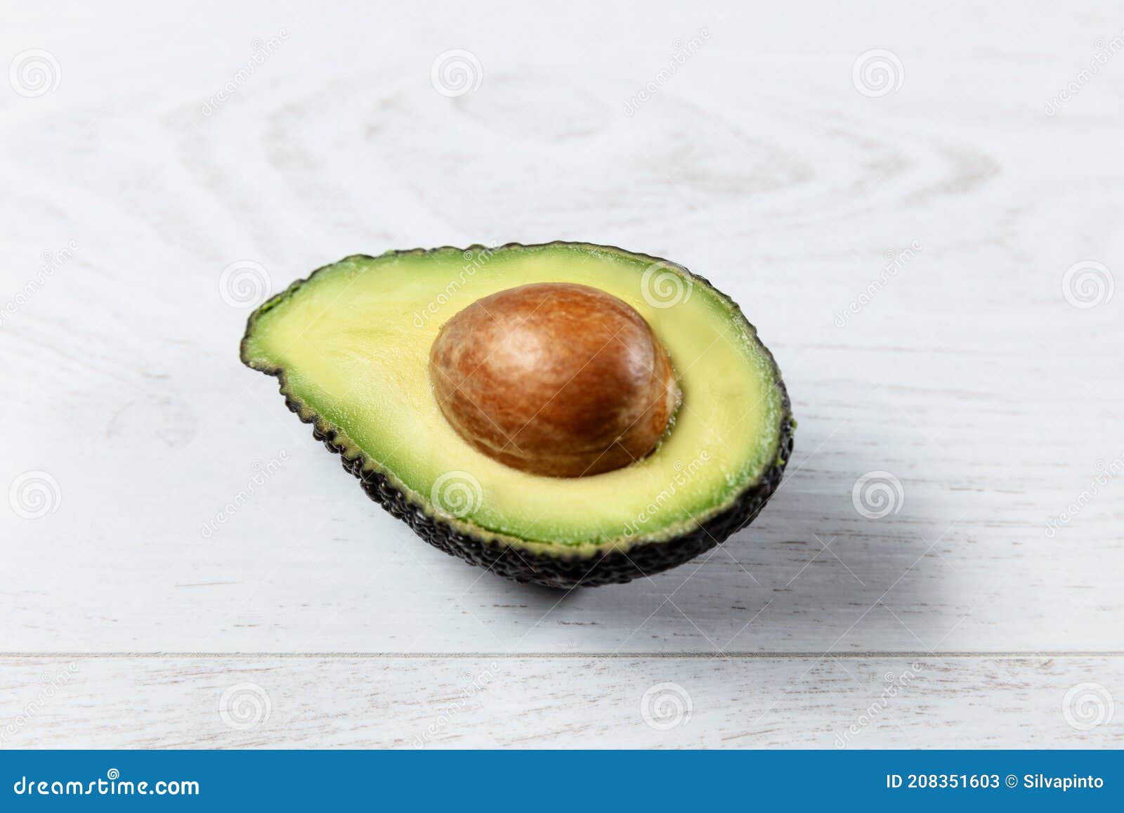 Avocado Open on Wooden Table Stock Image - Image of closeup, sliced ...