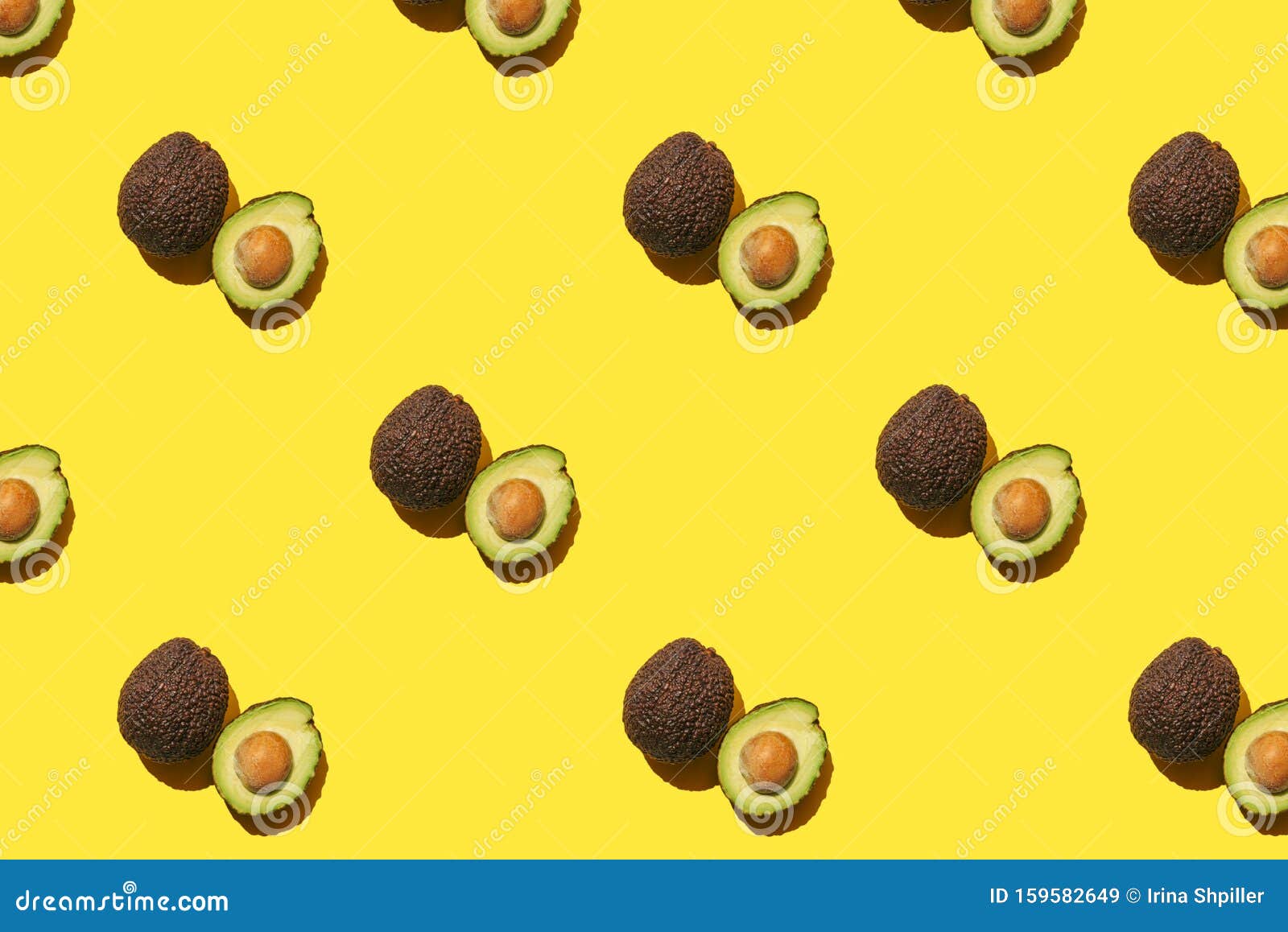 Avocado Pattern Made of Whole and Half Avocado on Yellow Background ...