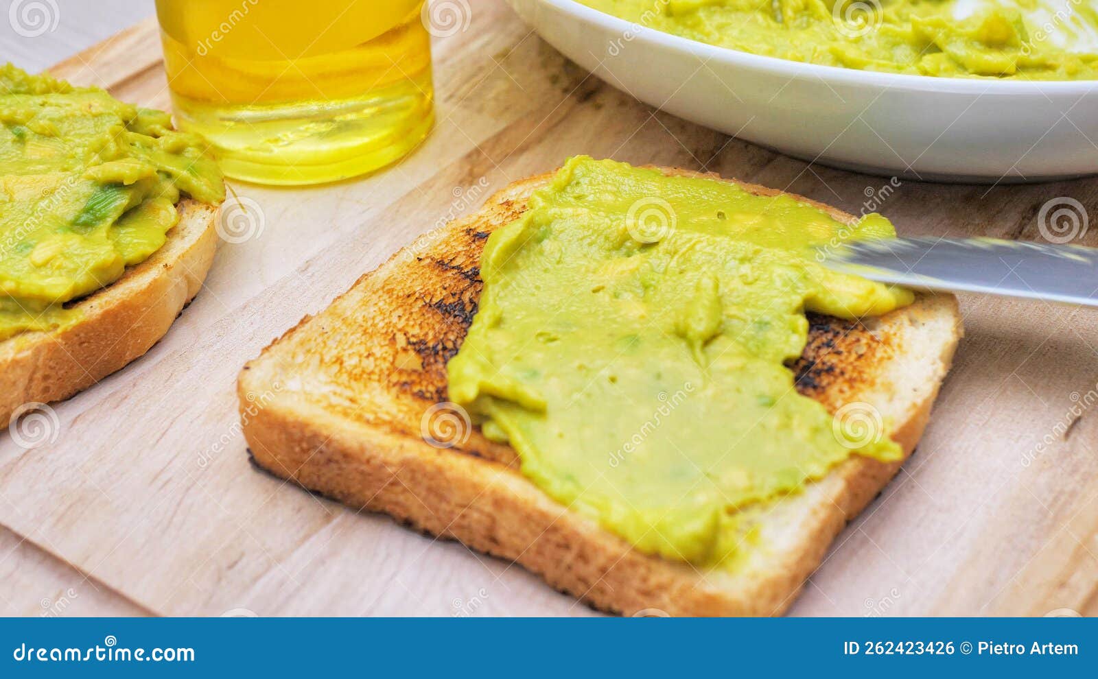 Avocado Spread with Grated Pepper and Toasted Sliced of Bread Stock ...