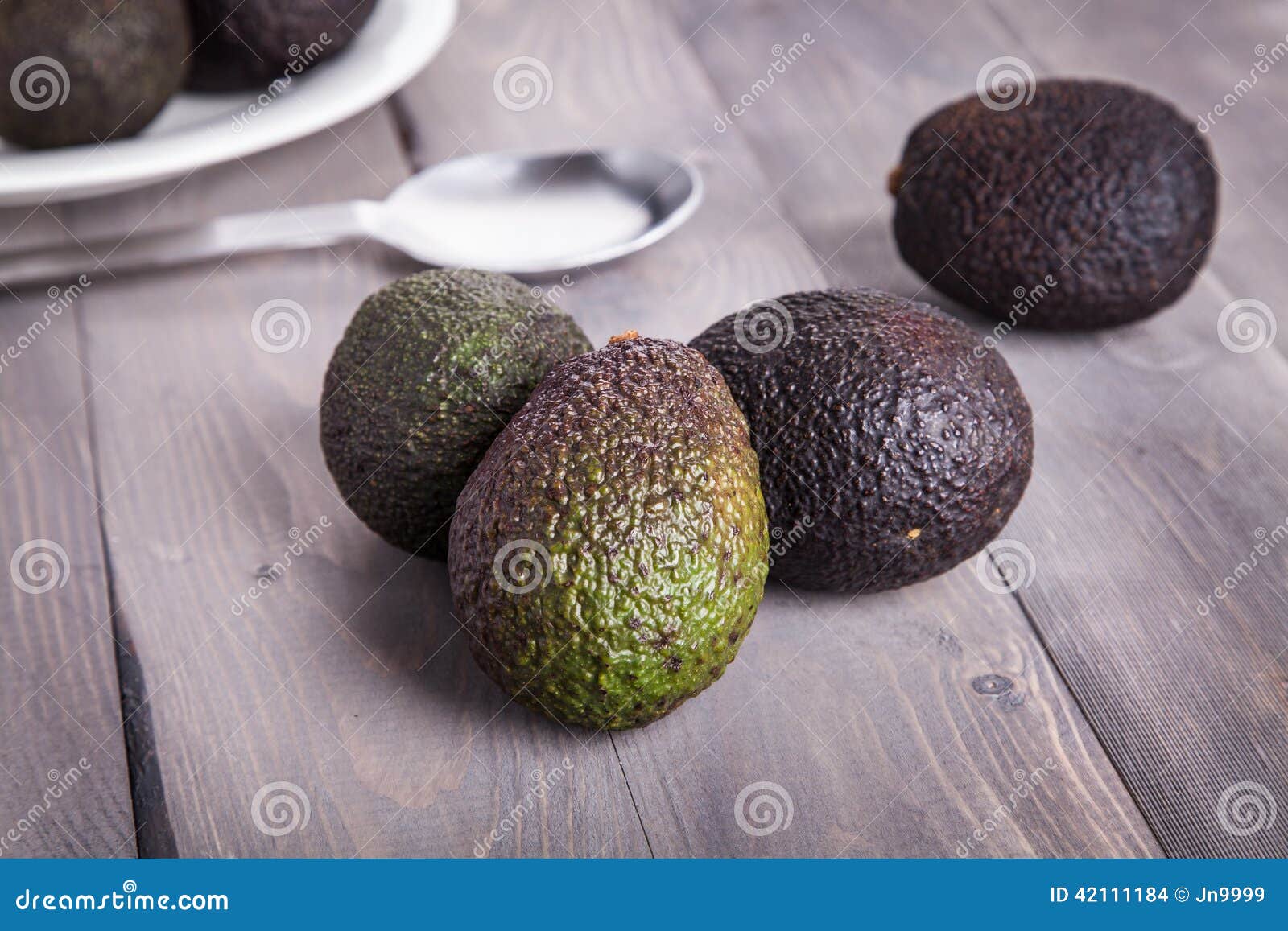 Avocado on a table stock photo. Image of wooden, ripe - 42111184