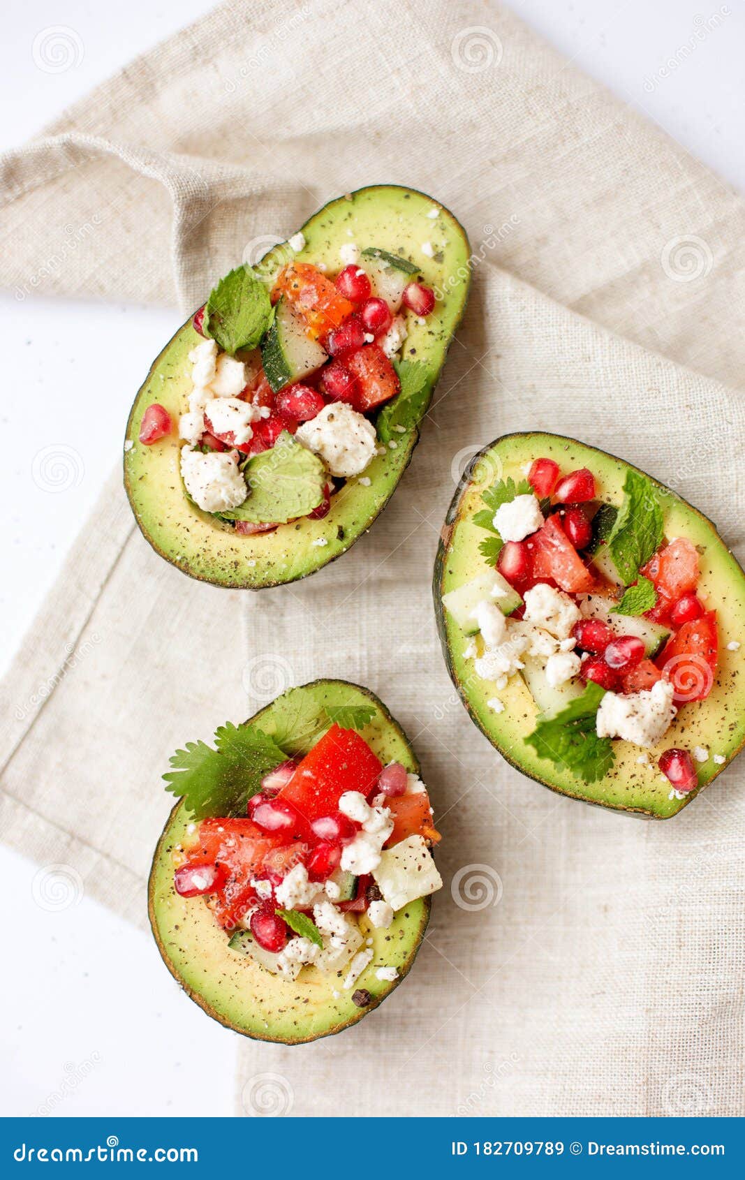 Avocado with Tomato, Pomegranate and Cheese Stock Image - Image of ...