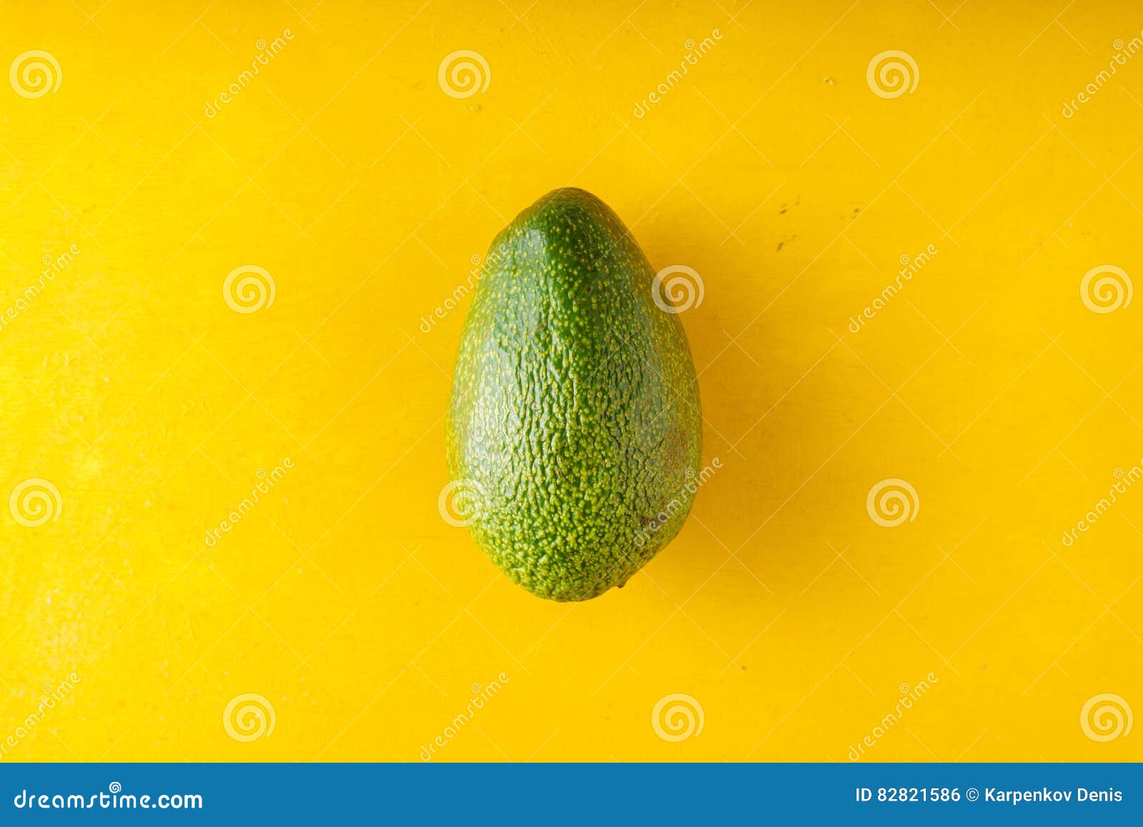 Avocado on a yellow table stock photo. Image of herb - 82821586