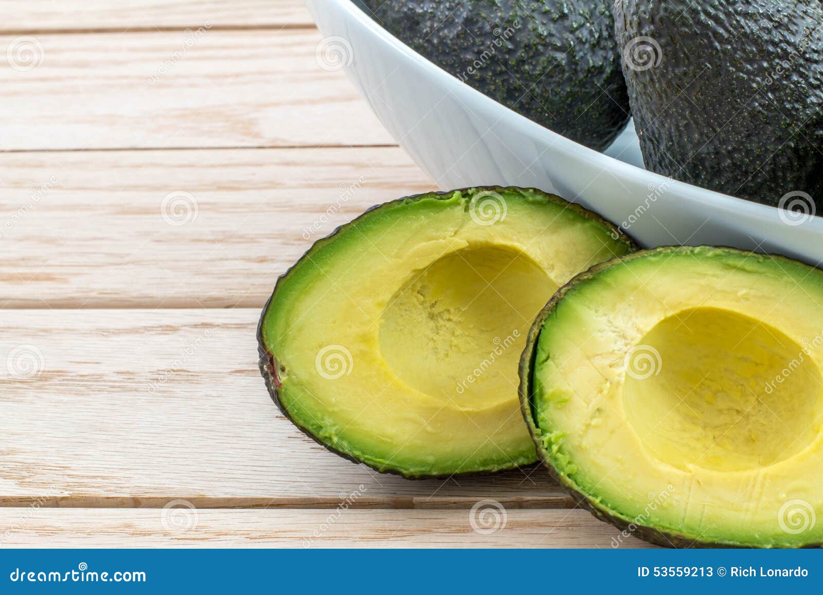 Avocados on a wood table stock image. Image of color - 53559213
