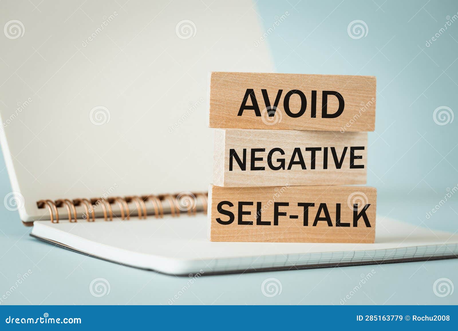 Avoid Negative Self-talk Written on Wooden Blocks Standing on an Open ...