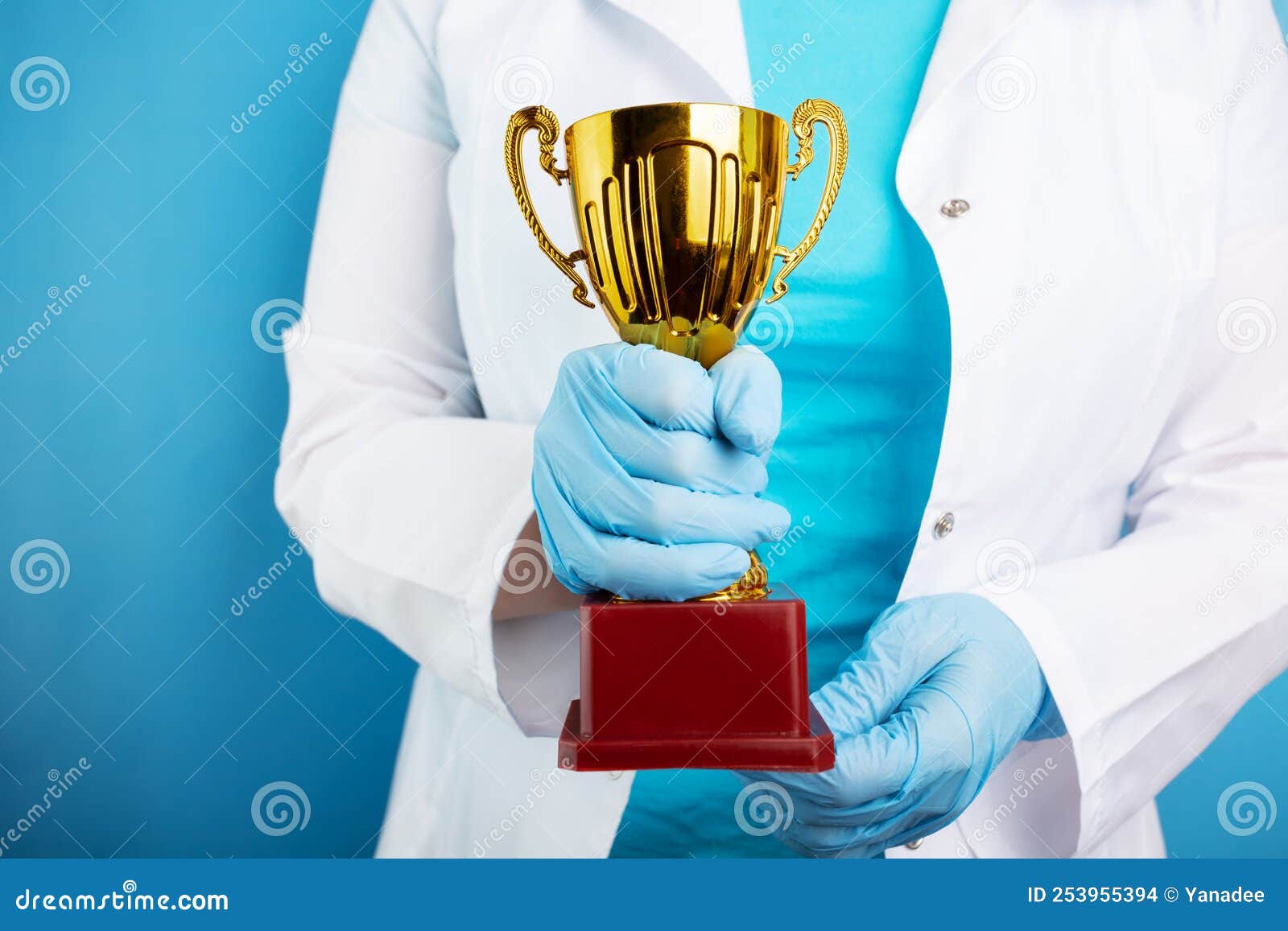 Award Cup in Doctor`s Hands on Blue Background Stock Photo - Image of ...