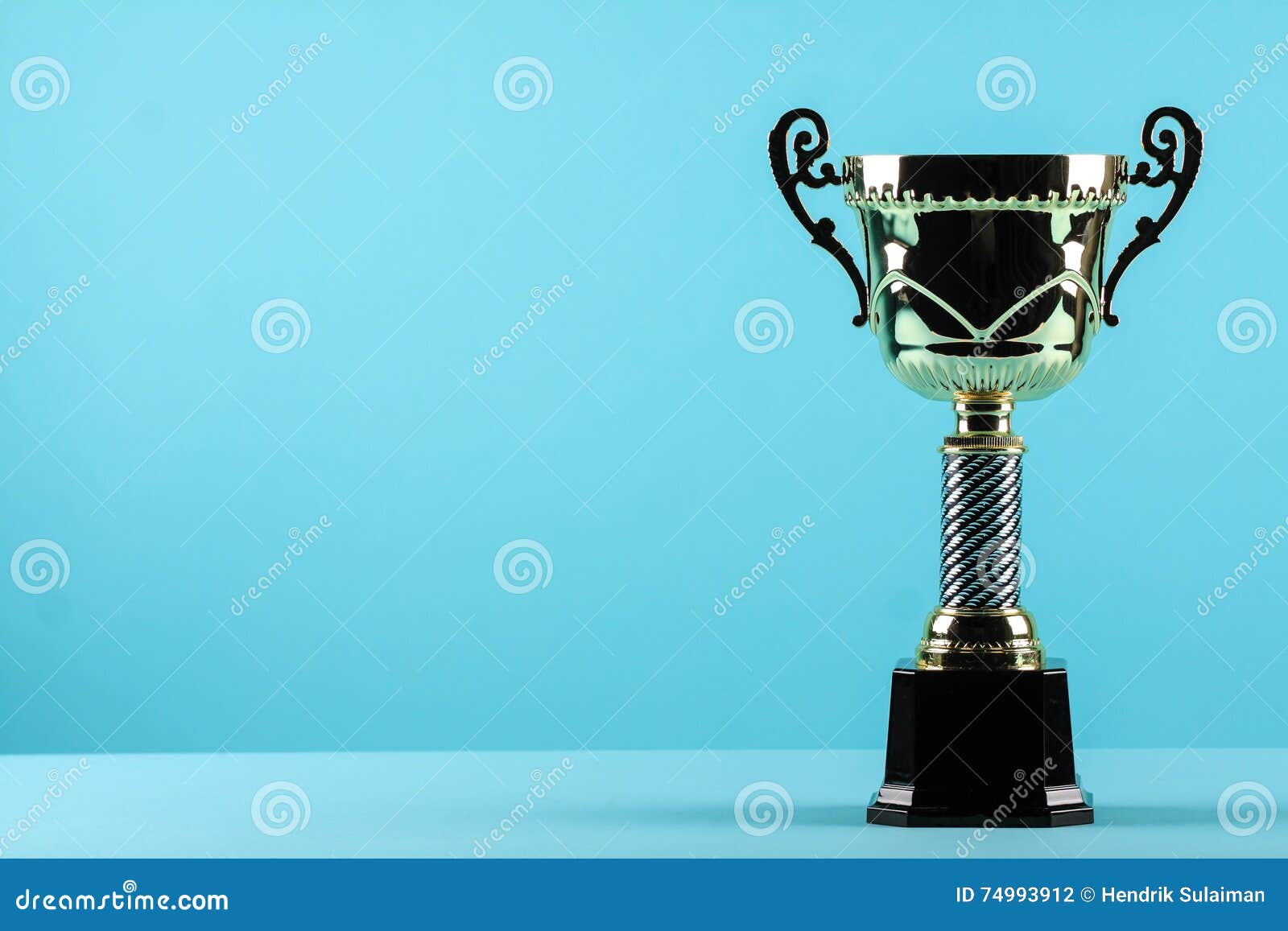 Award Winning Trophy in Blue Background Stock Photo - Image of ...