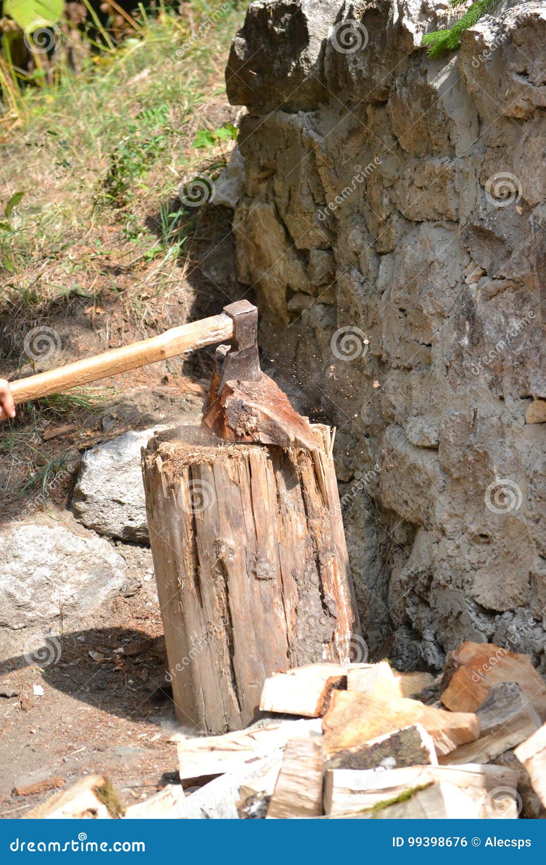 Axe in action cutting wood stock photo. Image of handles - 99398676