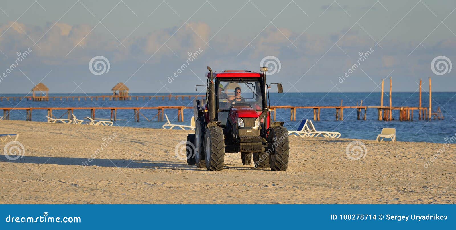 ! ayo Coco Beach, Cuba, Tractor with a Trailer on a Sandy Beach ...