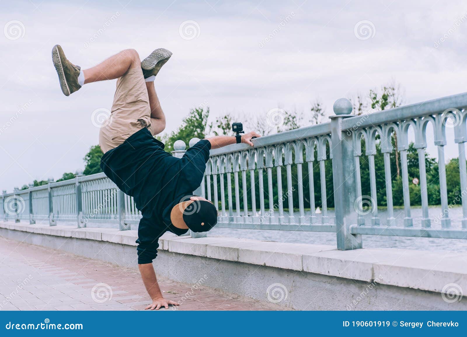 B-boy Break Dancer Stands on One Arm with an Action Camera Stock Image ...