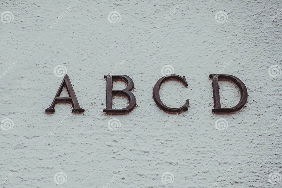A B C D Letters on the Wall of Building Stock Photo - Image of ...