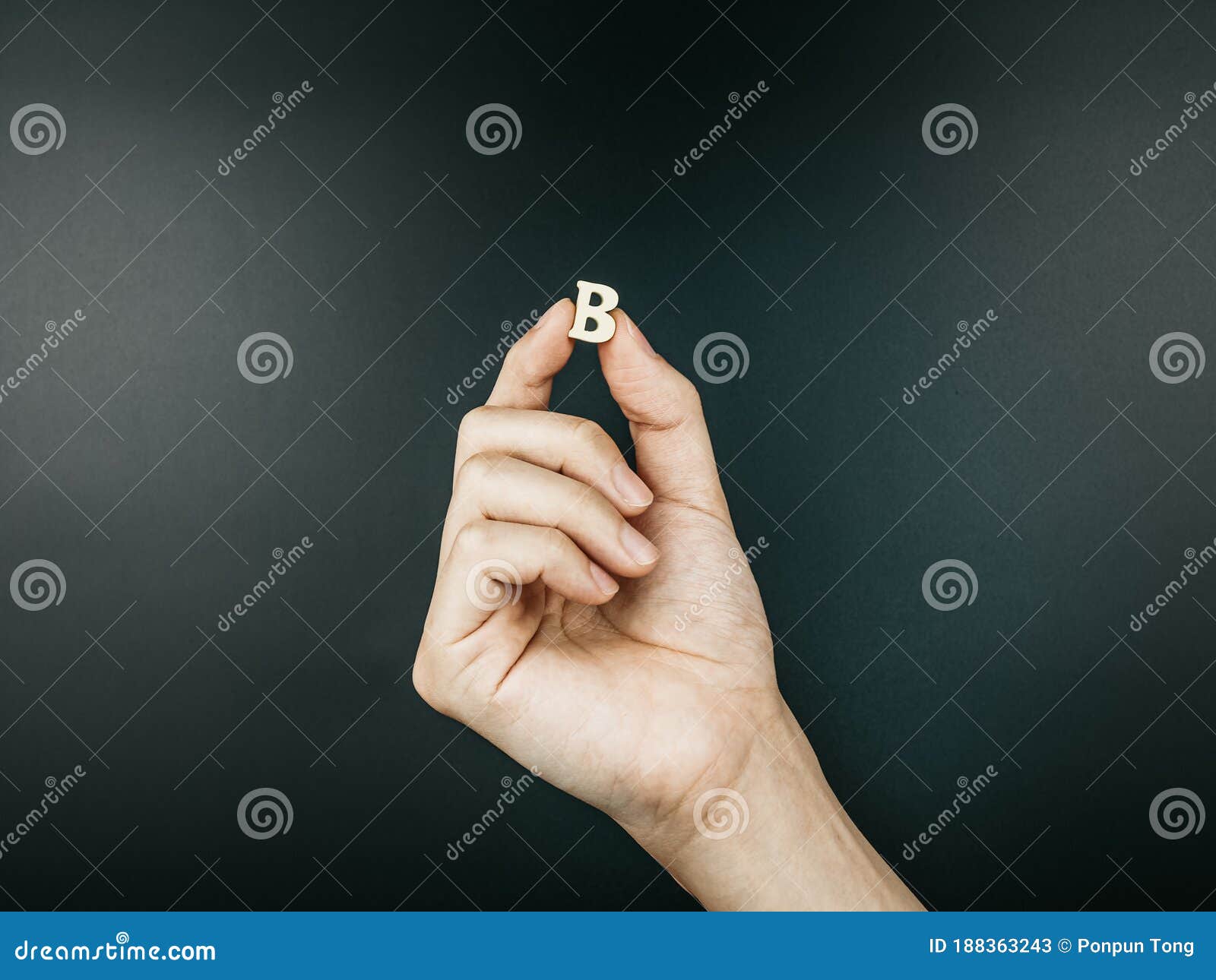 B Letter Hand Holding with Dark Background Stock Image - Image of ...