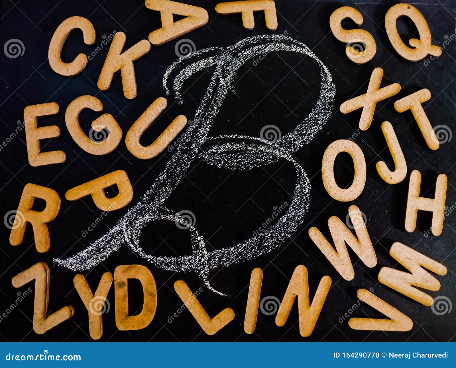 B Letter Presented with Multiple Alphabet on Chalkboard Background ...
