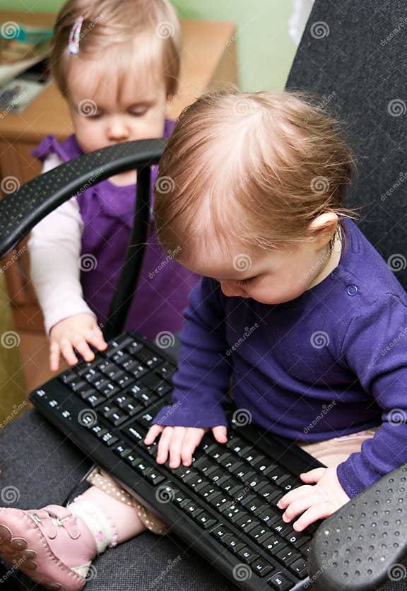 Babies with keyboard stock image. Image of computers - 18944349
