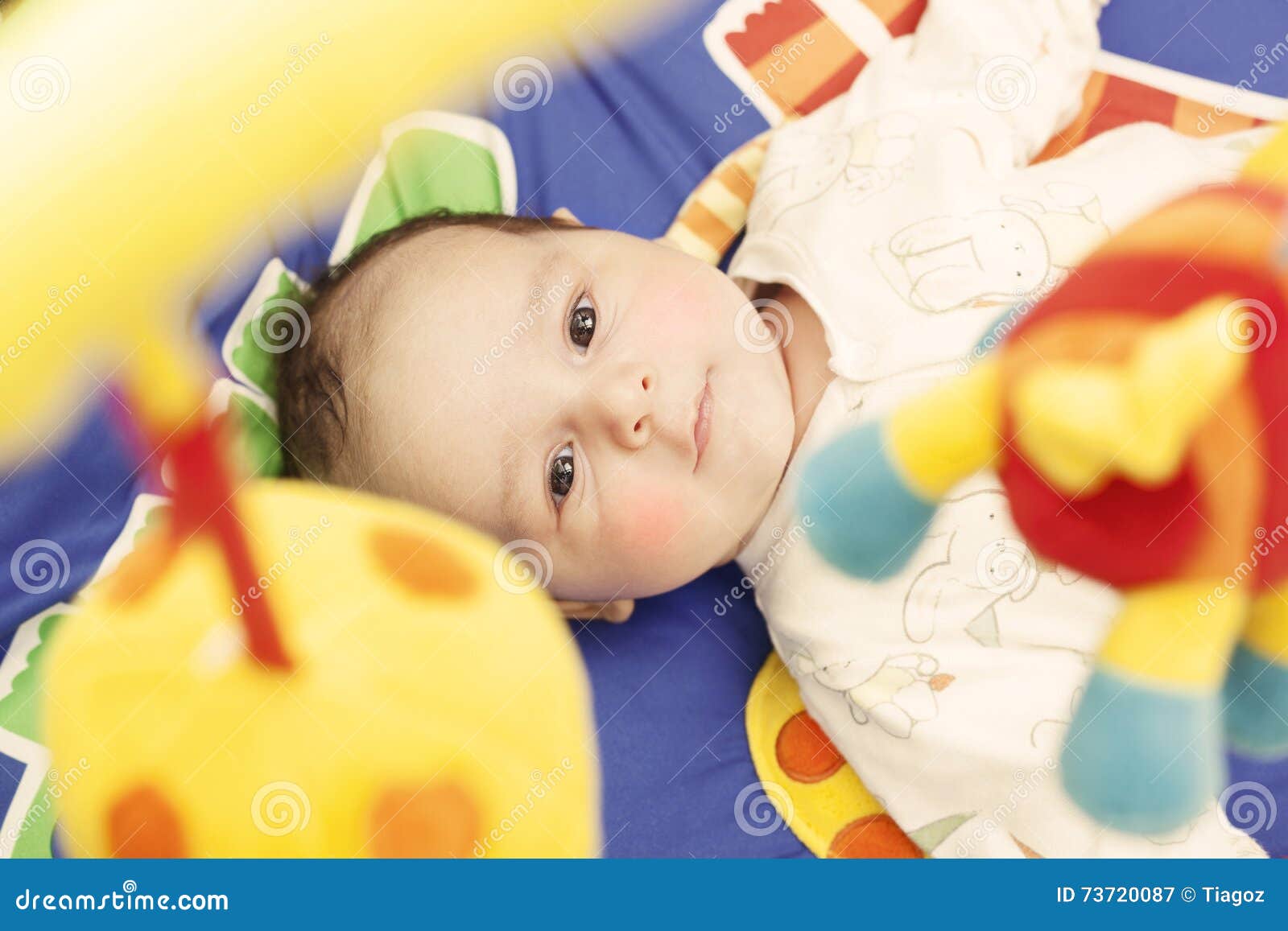 Baby on activity mat stock image. Image of noise, young - 73720087