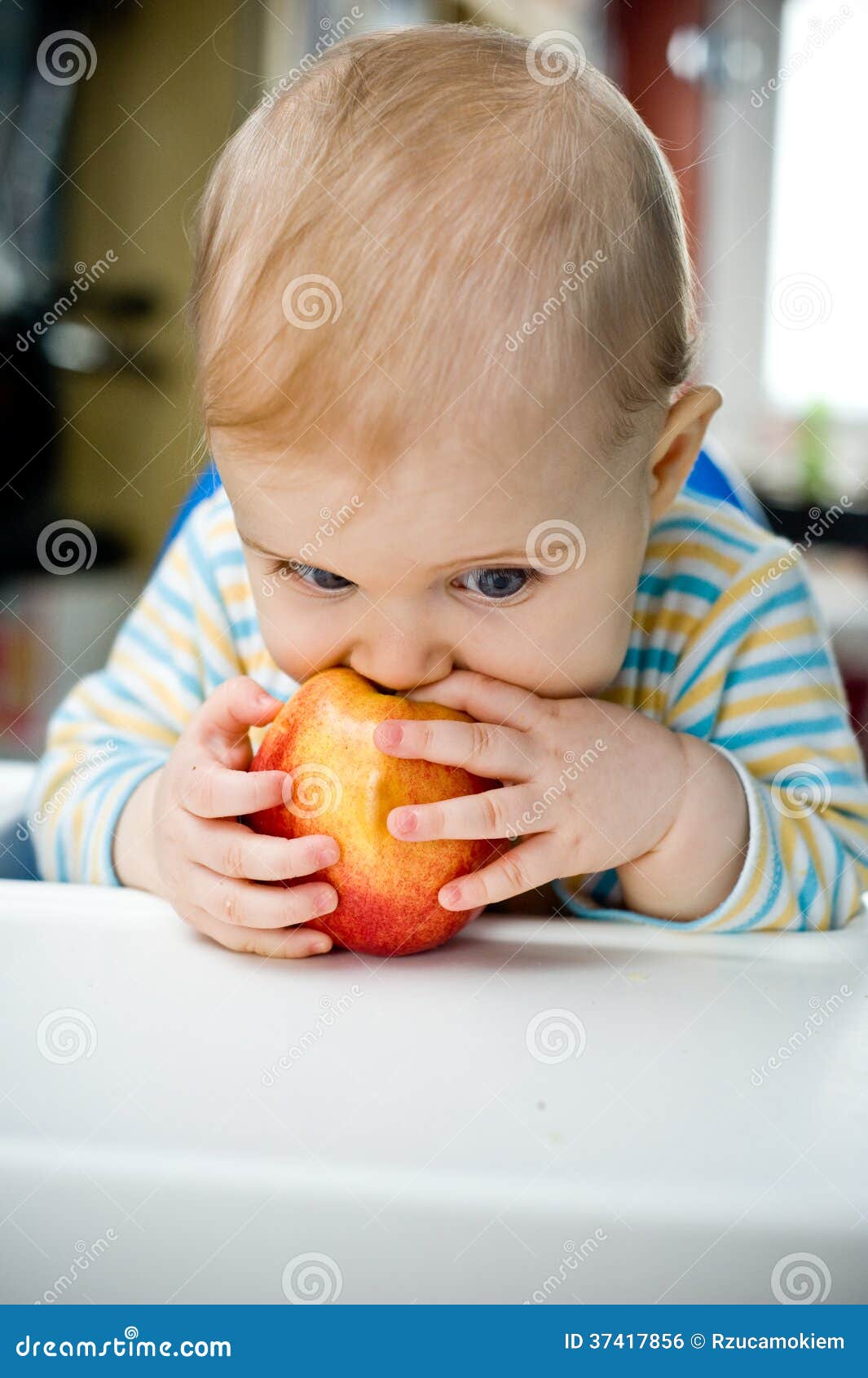 Baby with an Apple at Home; Vertical Stock Photo - Image of beautiful ...