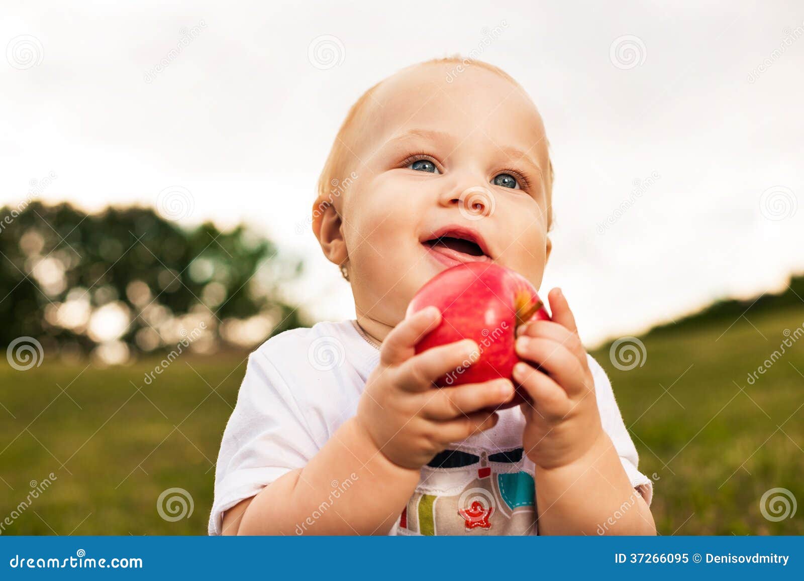 Baby with apple outdoors stock image. Image of child - 37266095