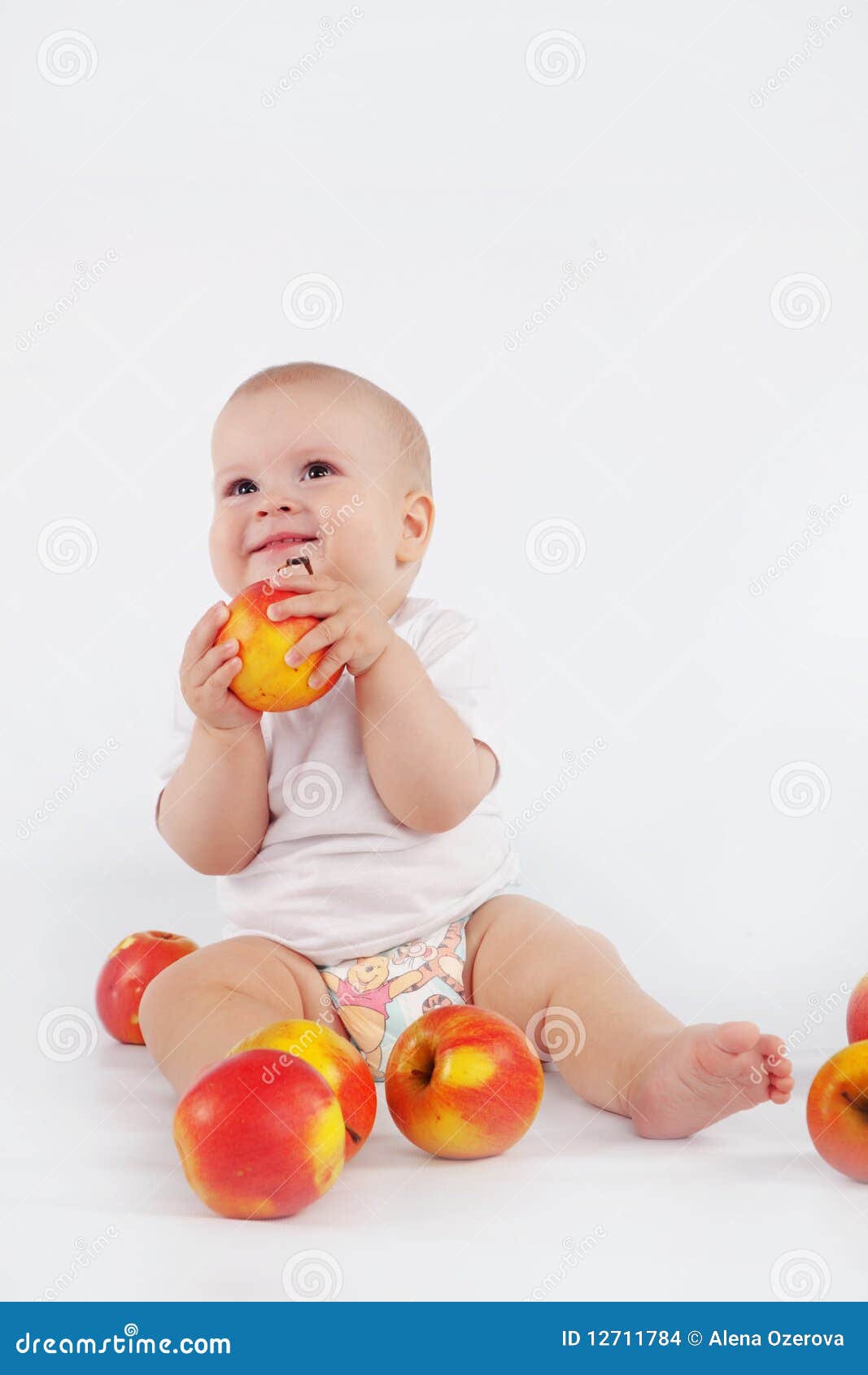 Baby with apples stock photo. Image of lovely, sitting - 12711784