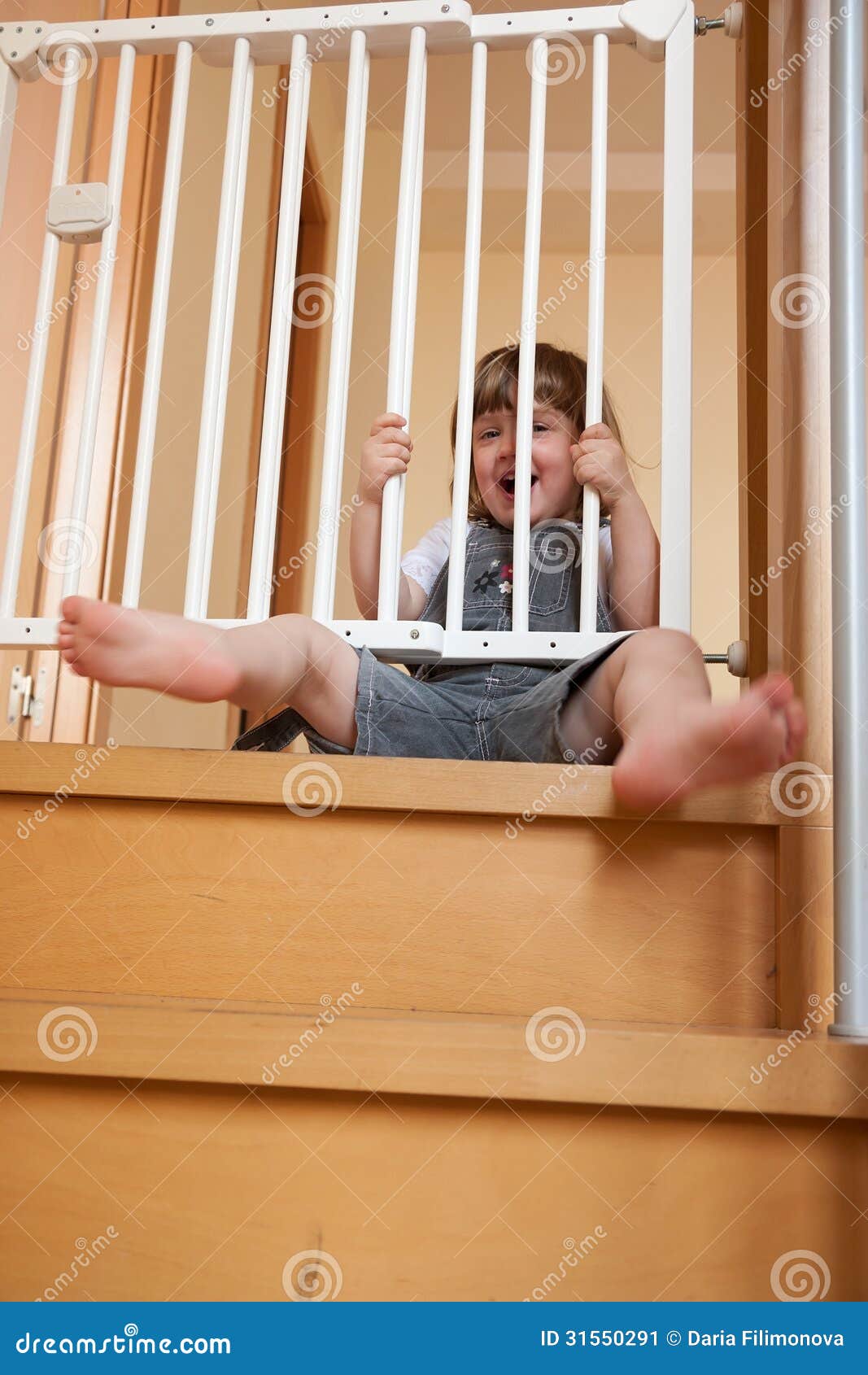 Baby Approaching Safety Gate Stock Image - Image of smiling, cute: 31550291