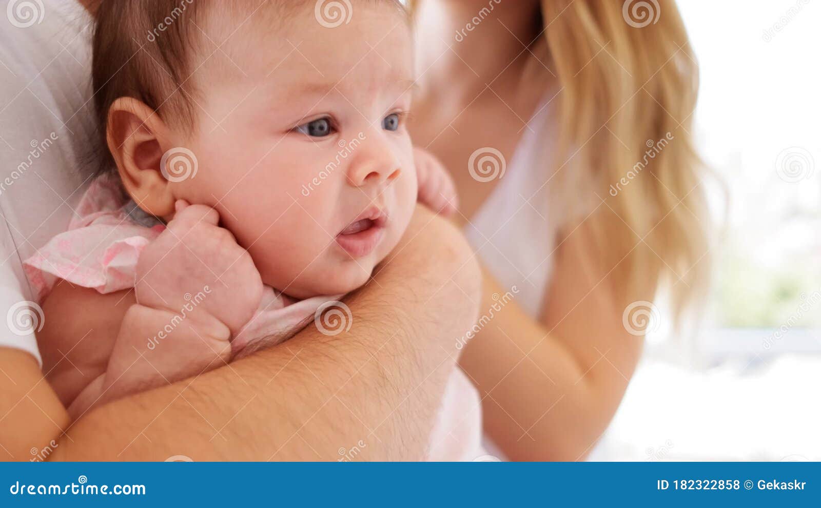 Baby in Arms of Her Parents Stock Footage - Video of care, love: 182322858