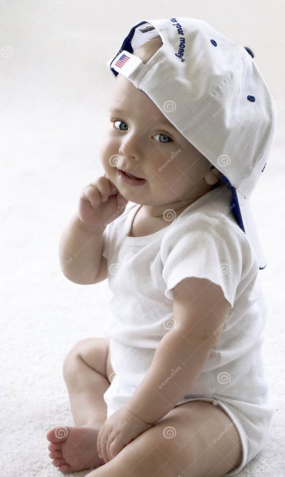 Baby in a baseball cap stock image. Image of baby, month - 652721