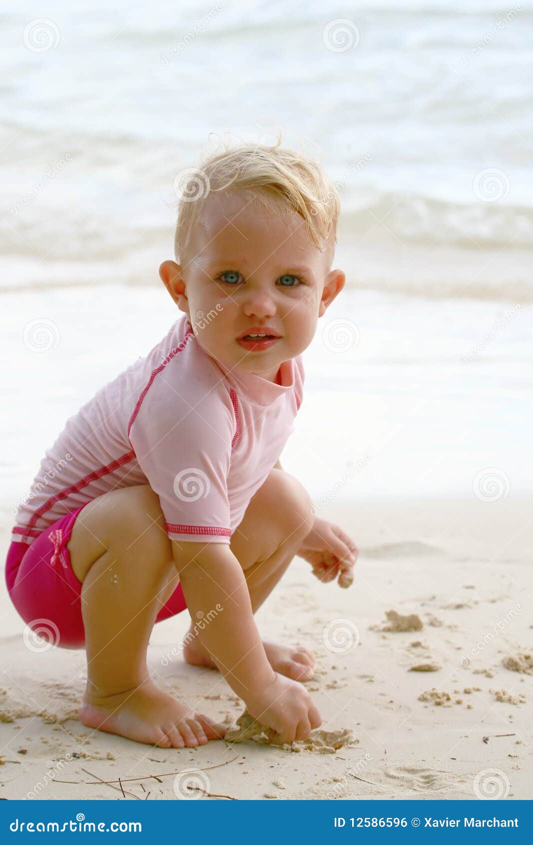 Baby on a beach stock photo. Image of swim, blue, hair - 12586596