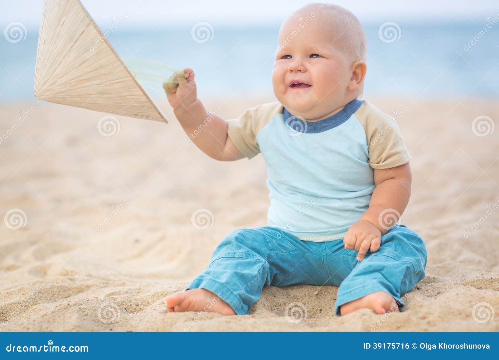 Baby on the beach stock photo. Image of adorable, interest - 39175716