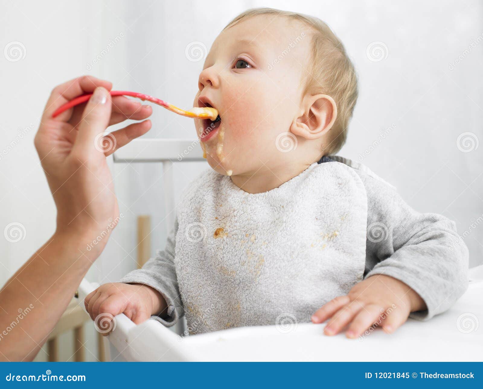 Baby Being Fed stock image. Image of baby, inside, high - 12021845