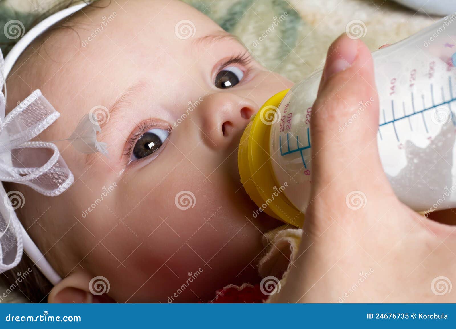 Baby being fed baby food stock image. Image of hand, daughter - 24676735