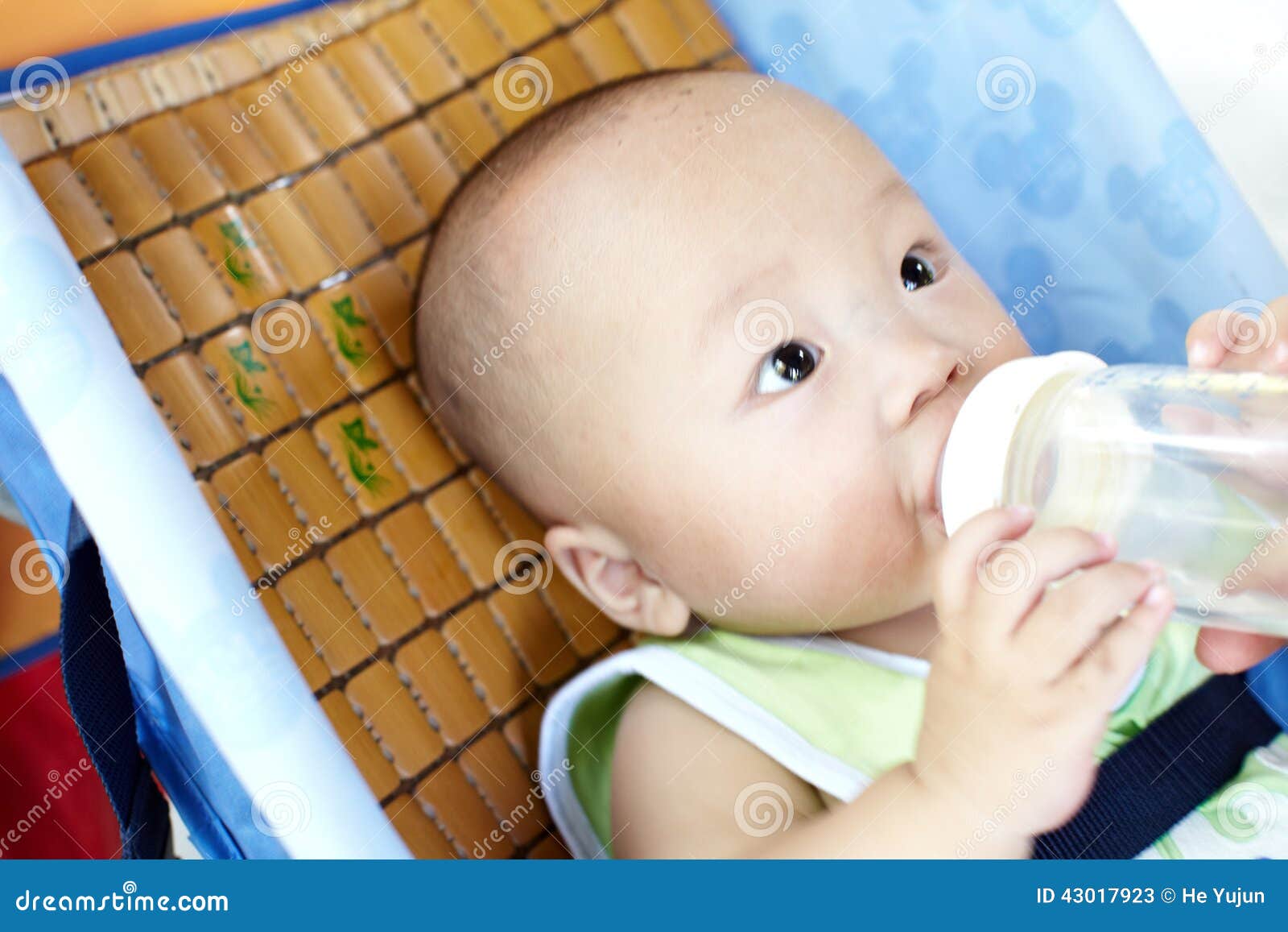 Baby being fed stock image. Image of stroller, bottle - 43017923