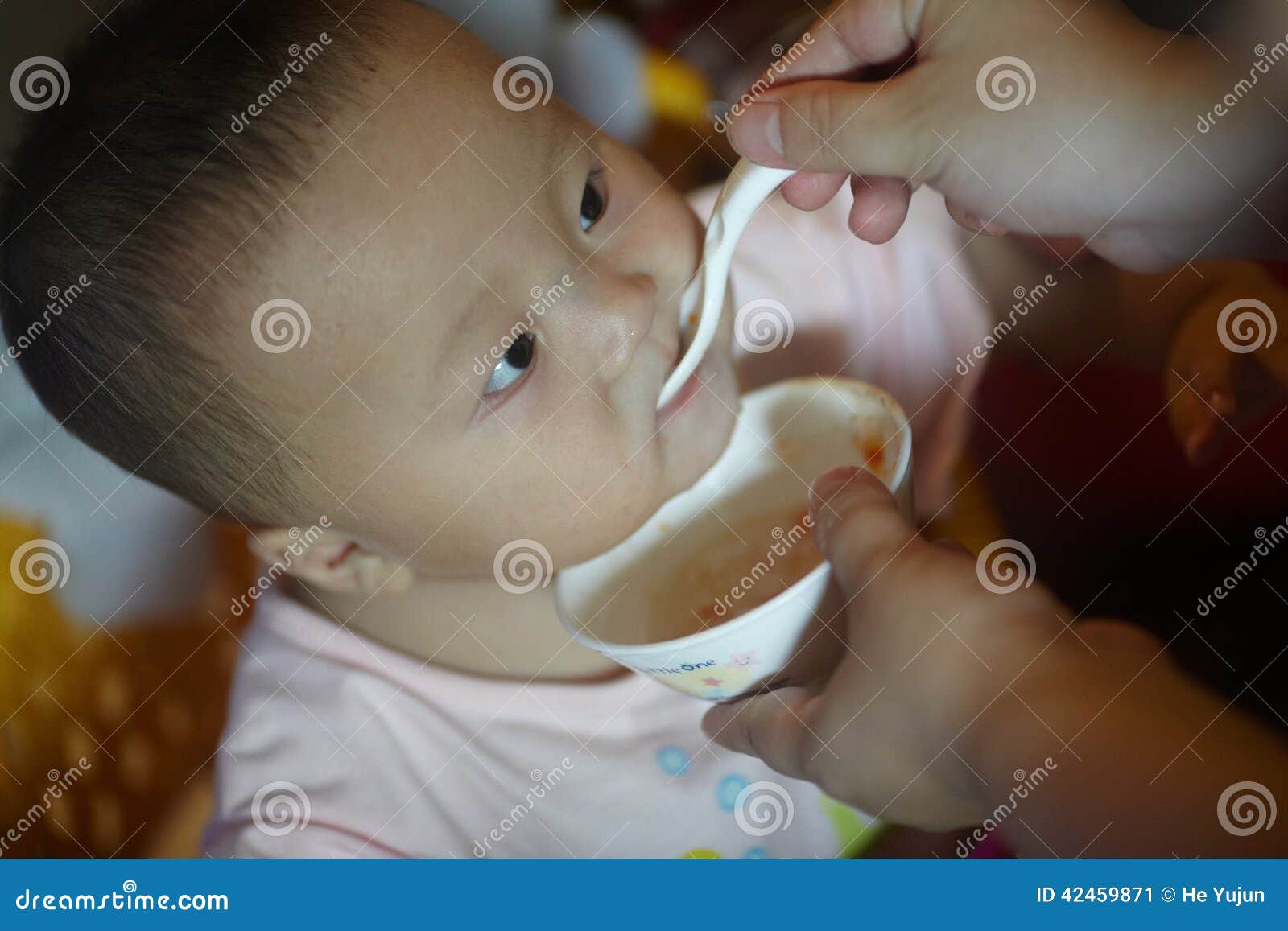 Baby being fed stock image. Image of infant, look, happy - 42459871