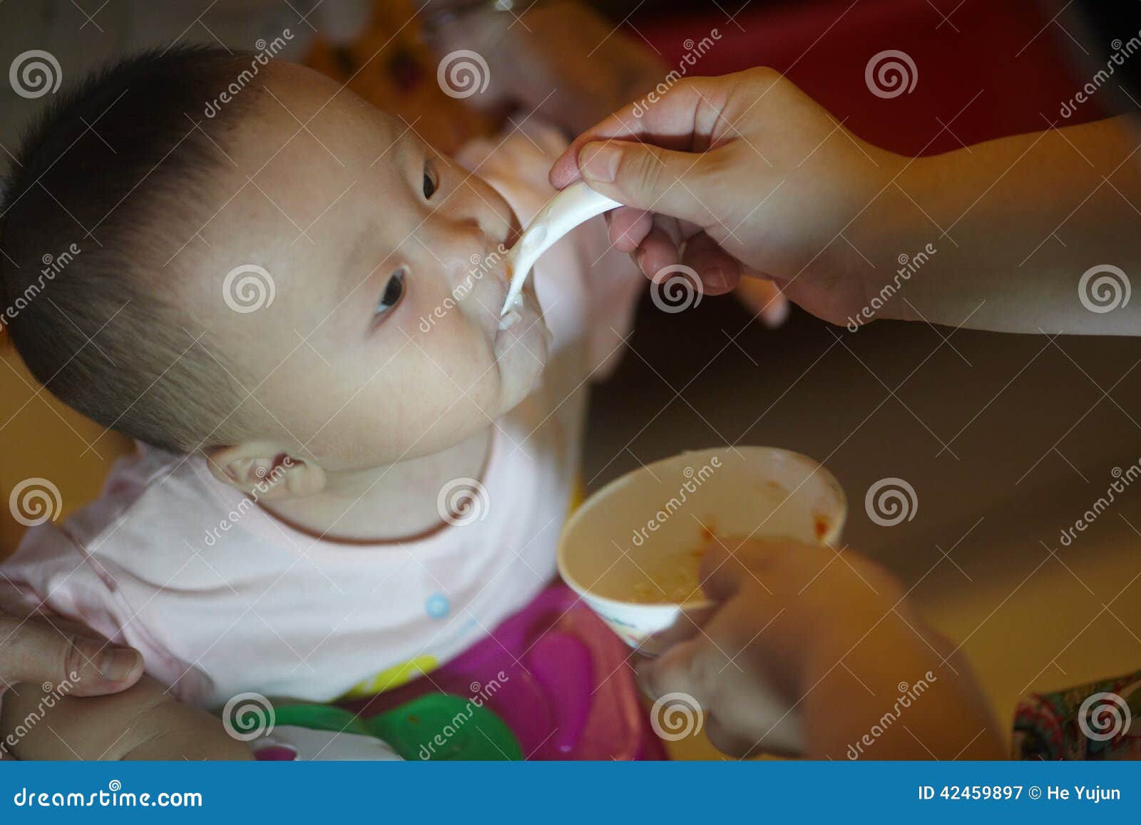 Baby being fed stock image. Image of happy, infant, stroller - 42459897