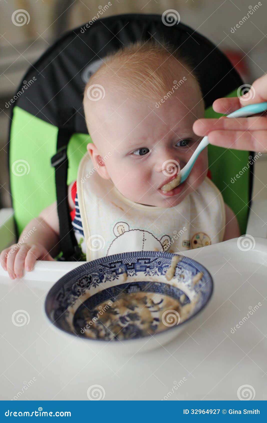 Baby being spoon-fed. stock image. Image of cute, concept - 32964927