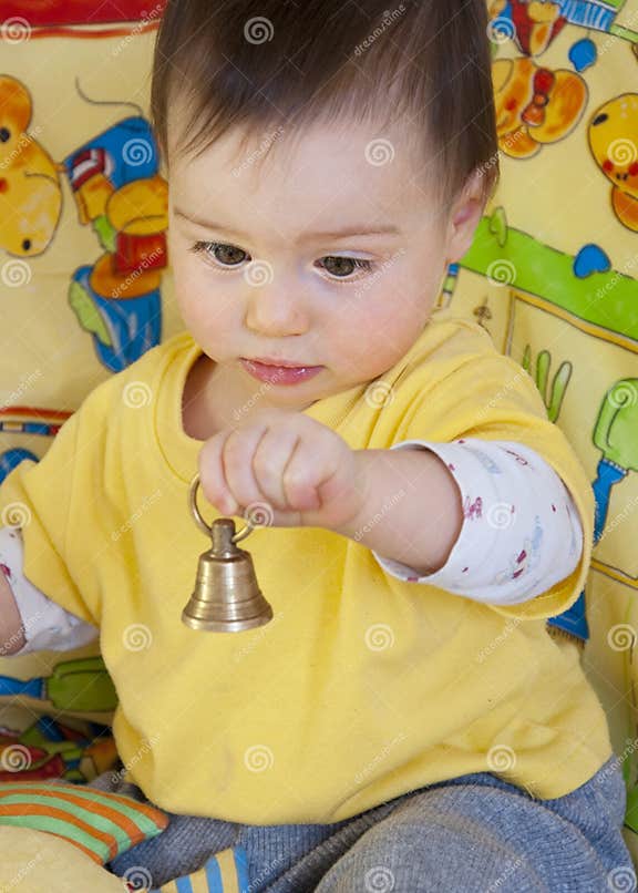 Baby with bell stock photo. Image of close, sitting, childhood - 17024830