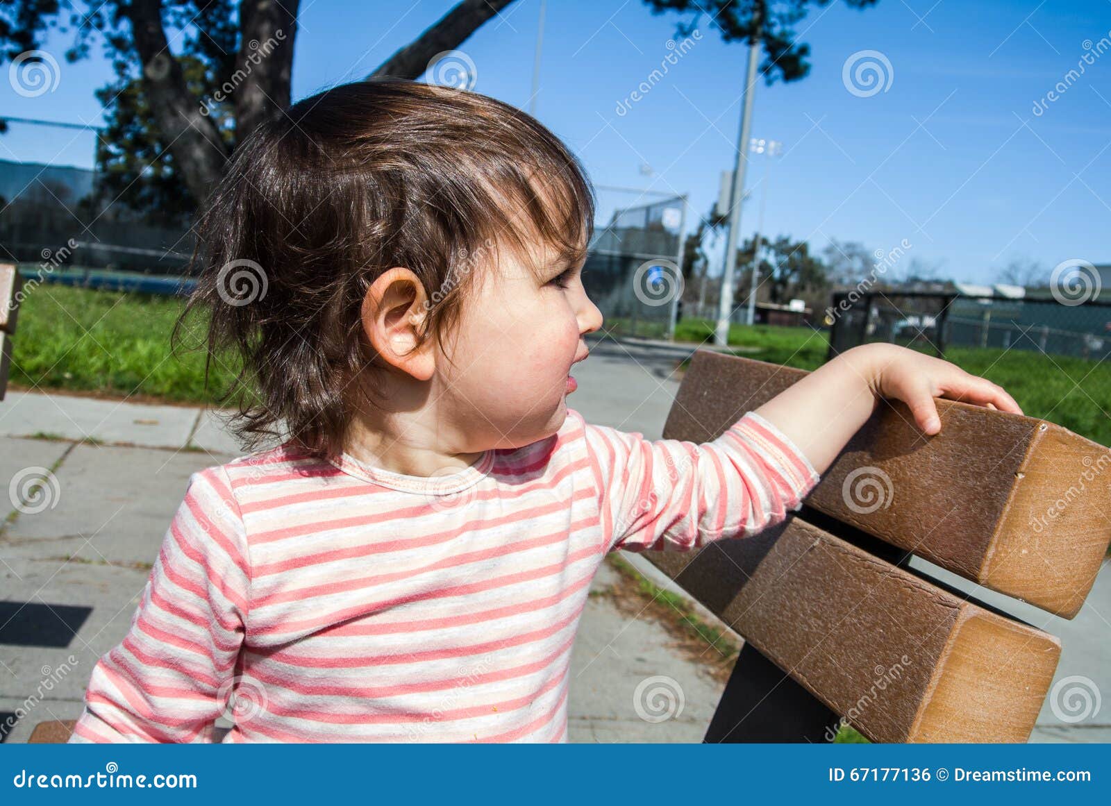 Baby on the Bench in the Park Stock Photo - Image of girl, sitting ...