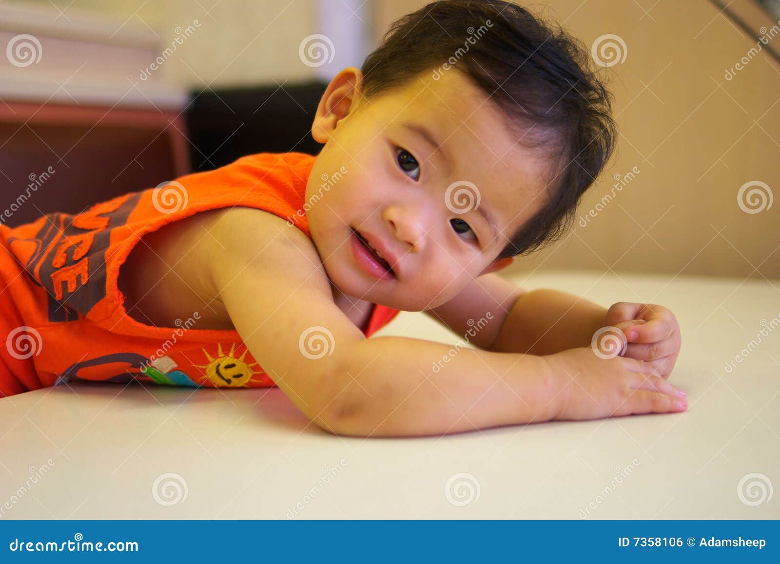 A baby bend over the table stock photo. Image of infant - 7358106