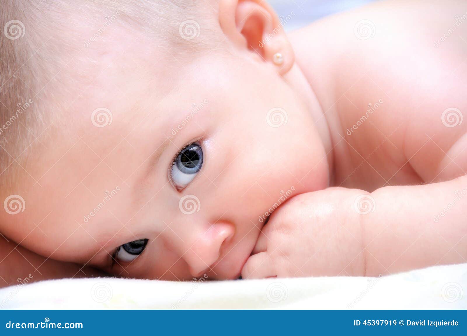 Baby bites the hand stock image. Image of foreground - 45397919