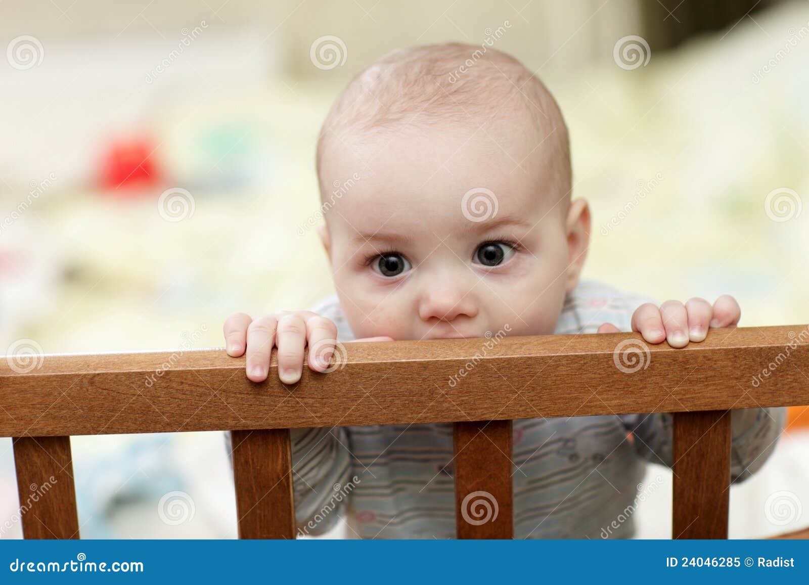 Baby biting cot stock image. Image of adorable, playful - 24046285