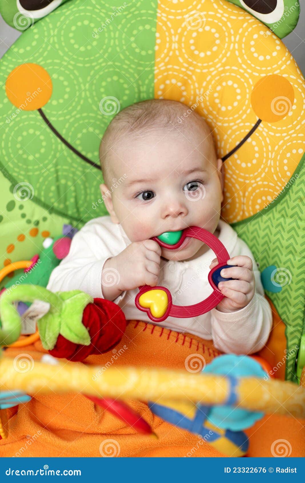 Baby biting rattle stock photo. Image of face, infant - 23322676