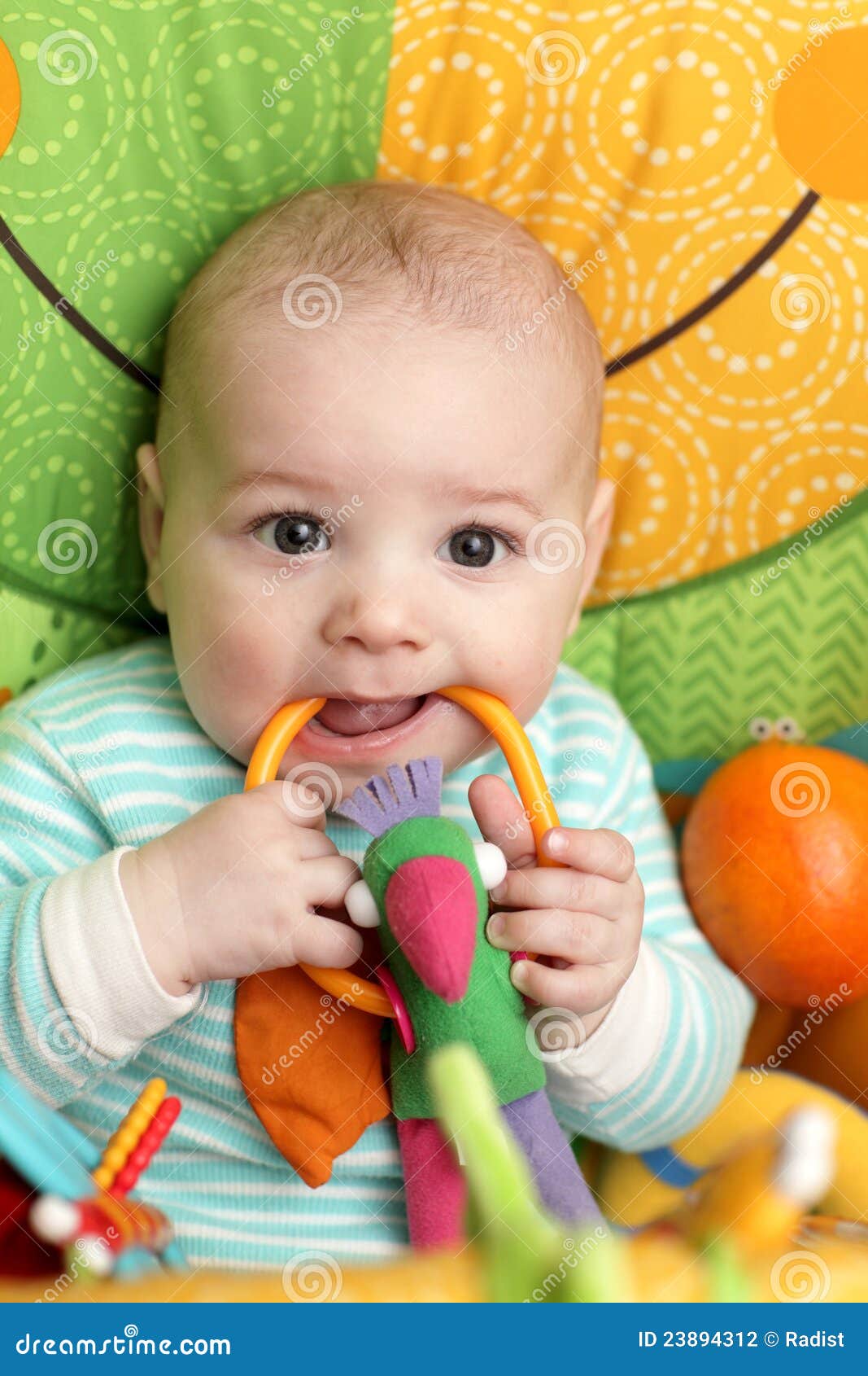 Baby biting rattle stock photo. Image of childhood, life - 23894312