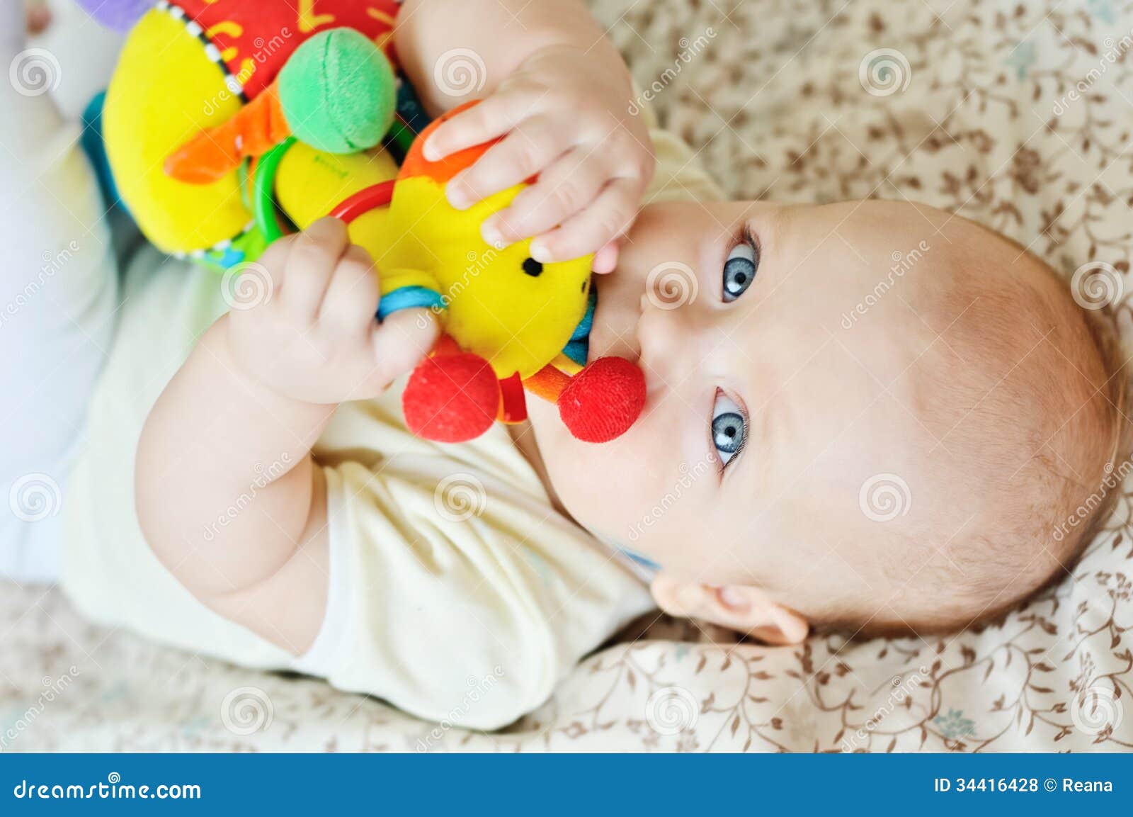 Baby biting toy stock photo. Image of offspring, incisor - 34416428