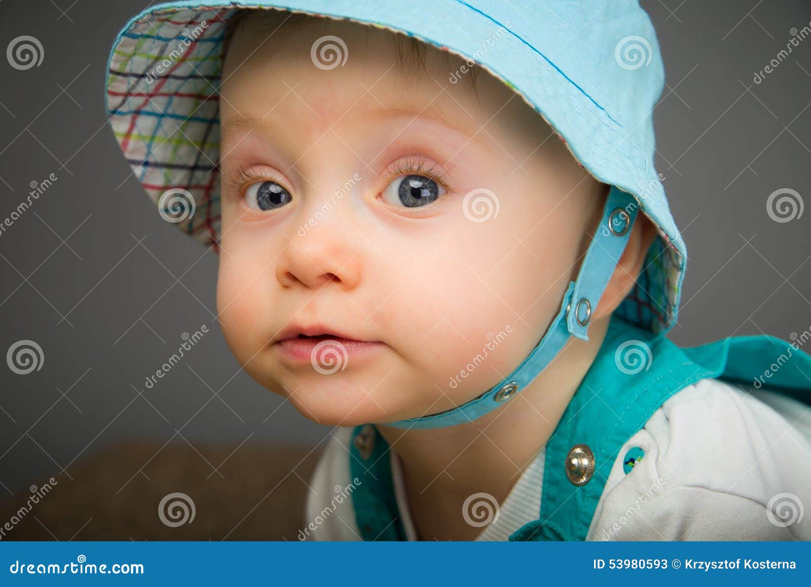 Baby in a blue cap stock image. Image of toys, playing - 53980593