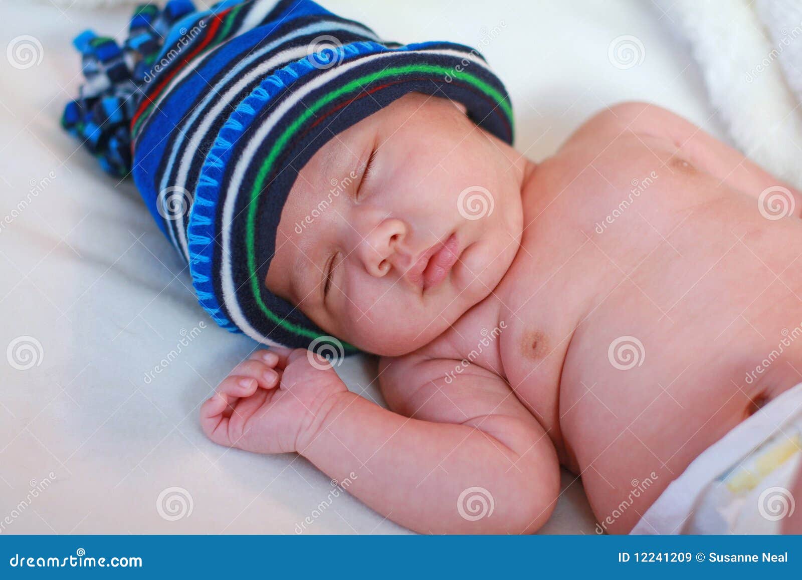Baby in blue cap sleeping stock image. Image of multicultural - 12241209