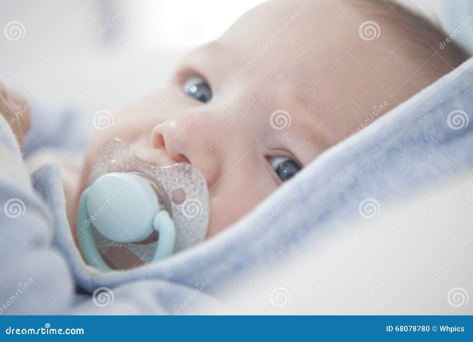 Baby with blue pacifier stock photo. Image of happy, healthy - 68078780