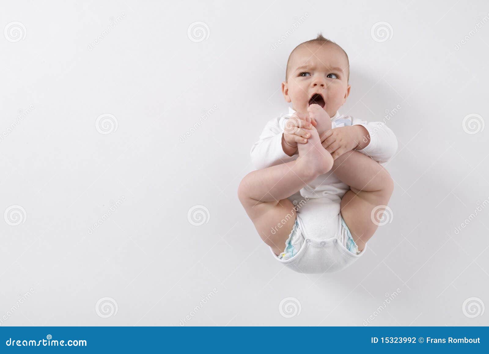 Baby Boy Biting Toe Stock Photography - Image: 15323992