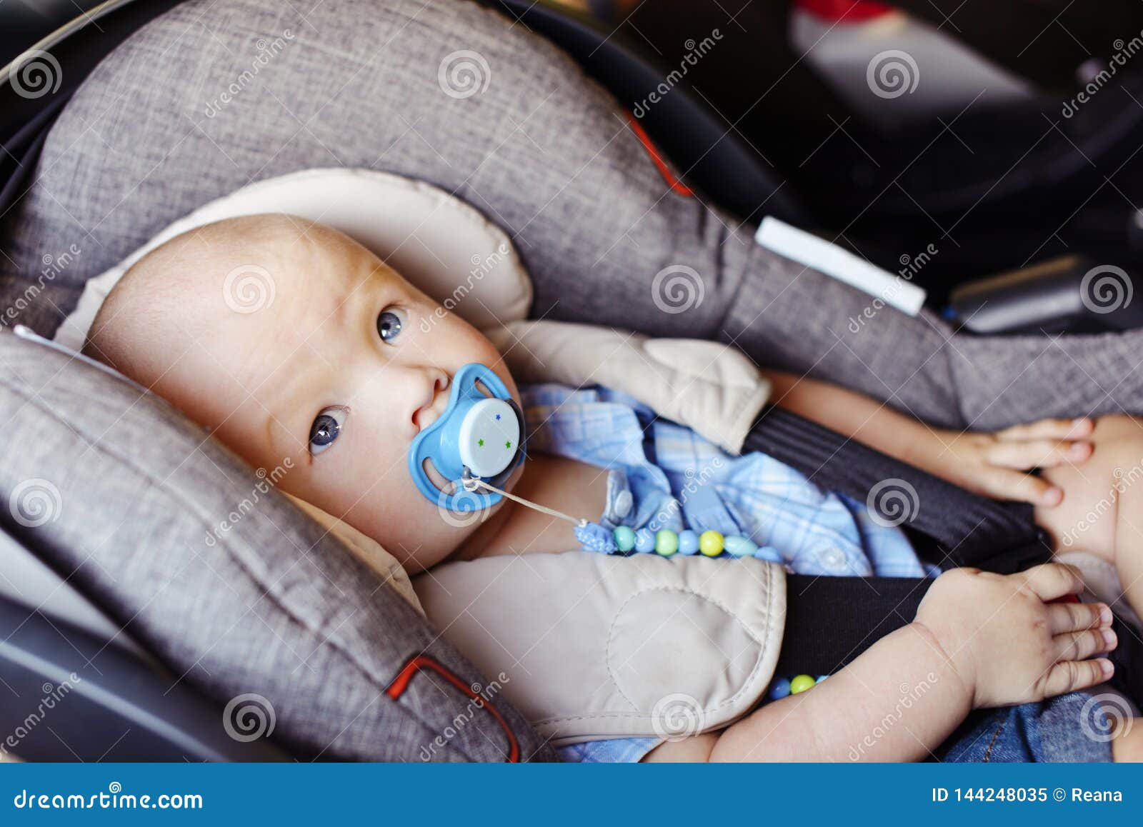 Baby boy in car seat stock image. Image of ride, baby - 144248035